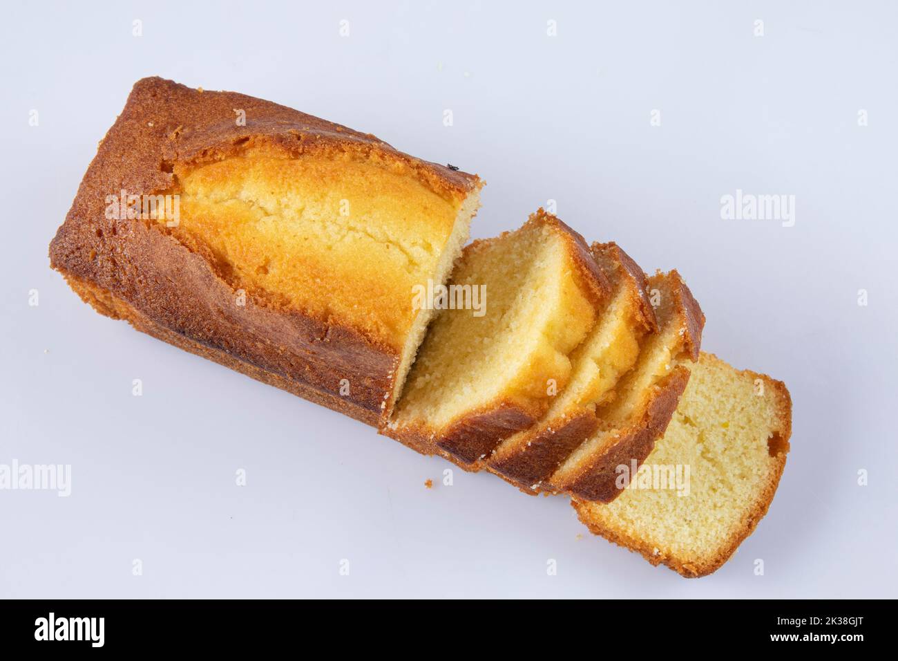 Sliced moist butter cake isolated over the white background. Pineapple ...
