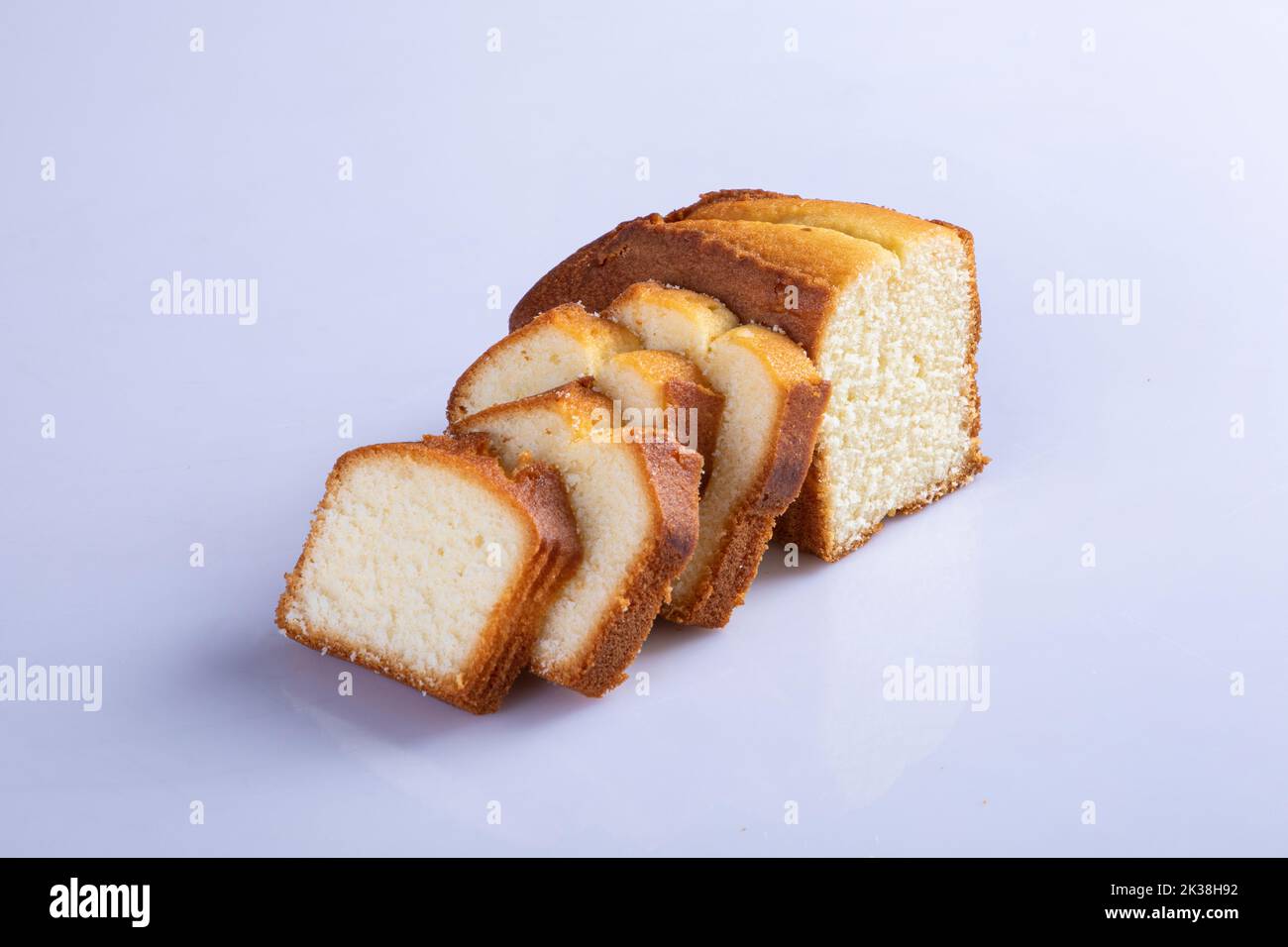Sliced moist butter cake isolated over the white background. Pineapple ...