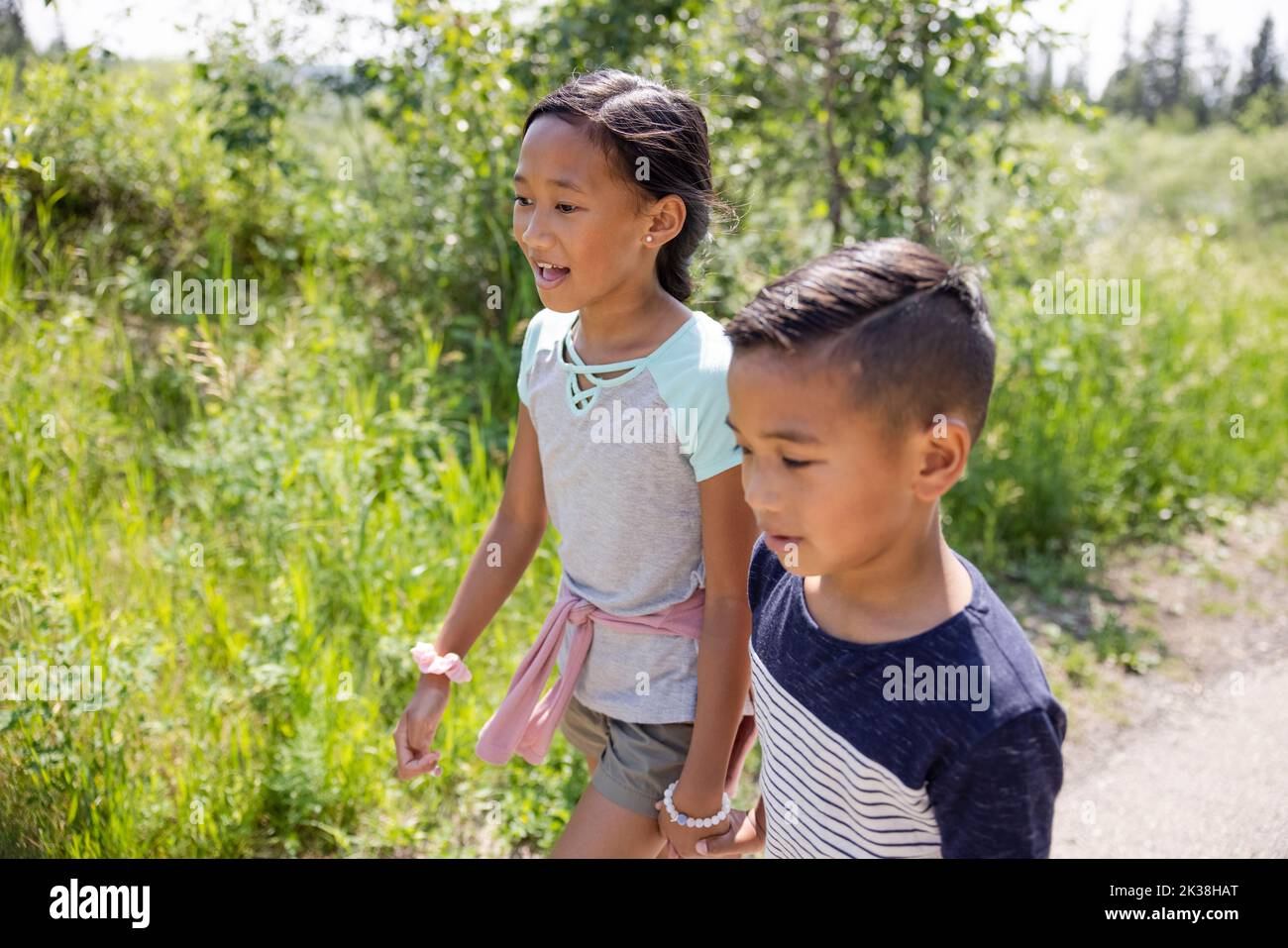 Little Boy And Girl Walking
