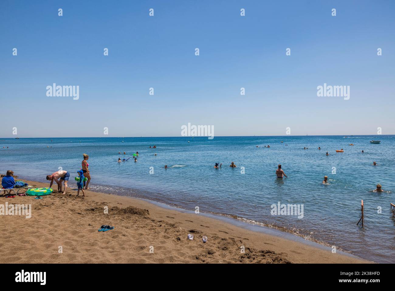 Family beach sand sea inflatable hi-res stock photography and images ...