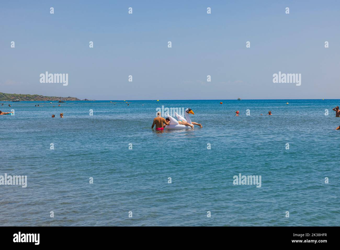 Family beach sand sea inflatable hi-res stock photography and images ...