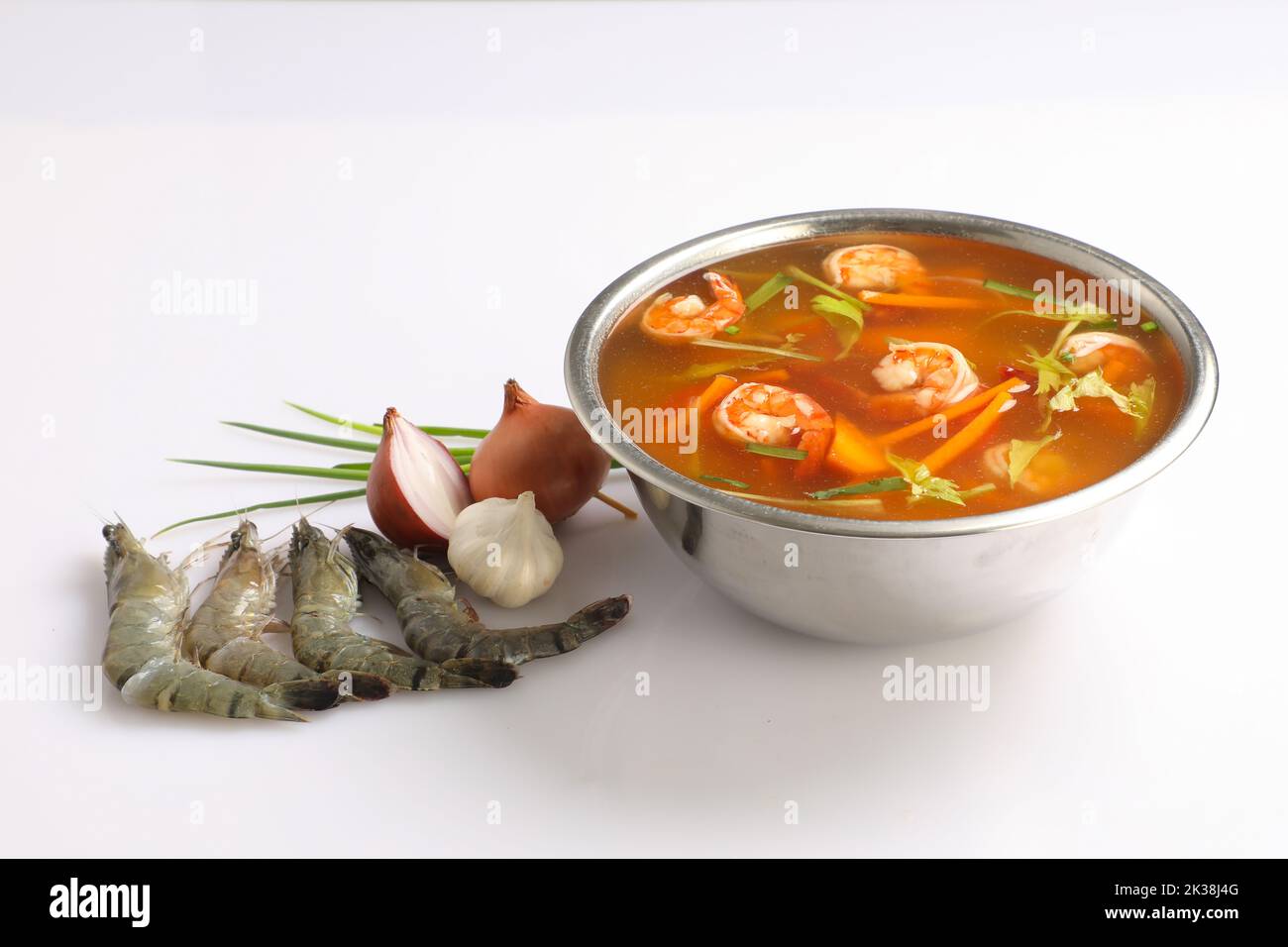 Tom Yam kung Spicy Thai soup with shrimp, seafood, and chili pepper in ...