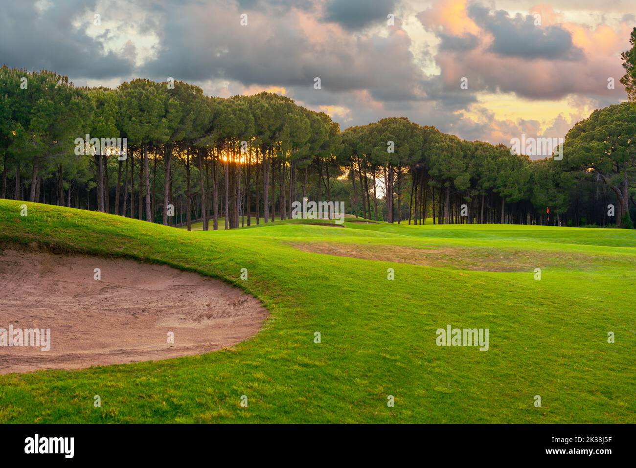 Panorama of the green on a golf course with a sand bunker in the center ...