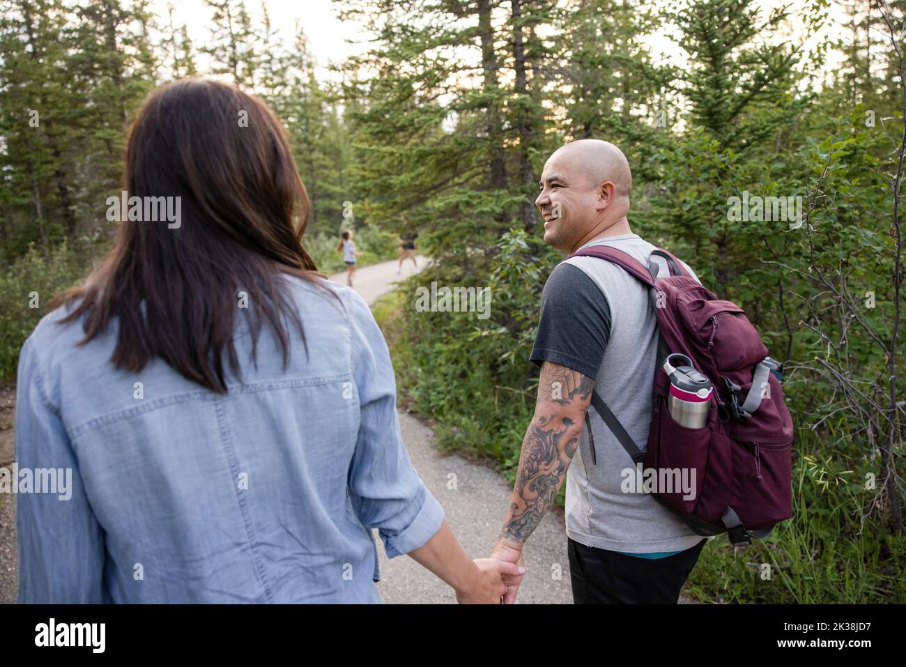 Caucasian couple walking on trail hi-res stock photography and images ...