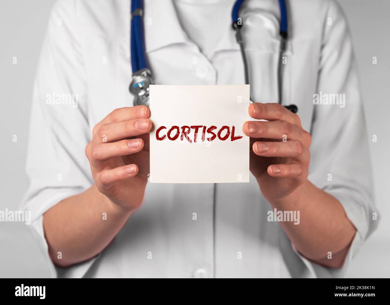 Cortisol hormone, word through magnifying glass. photo Stock Photo - Alamy
