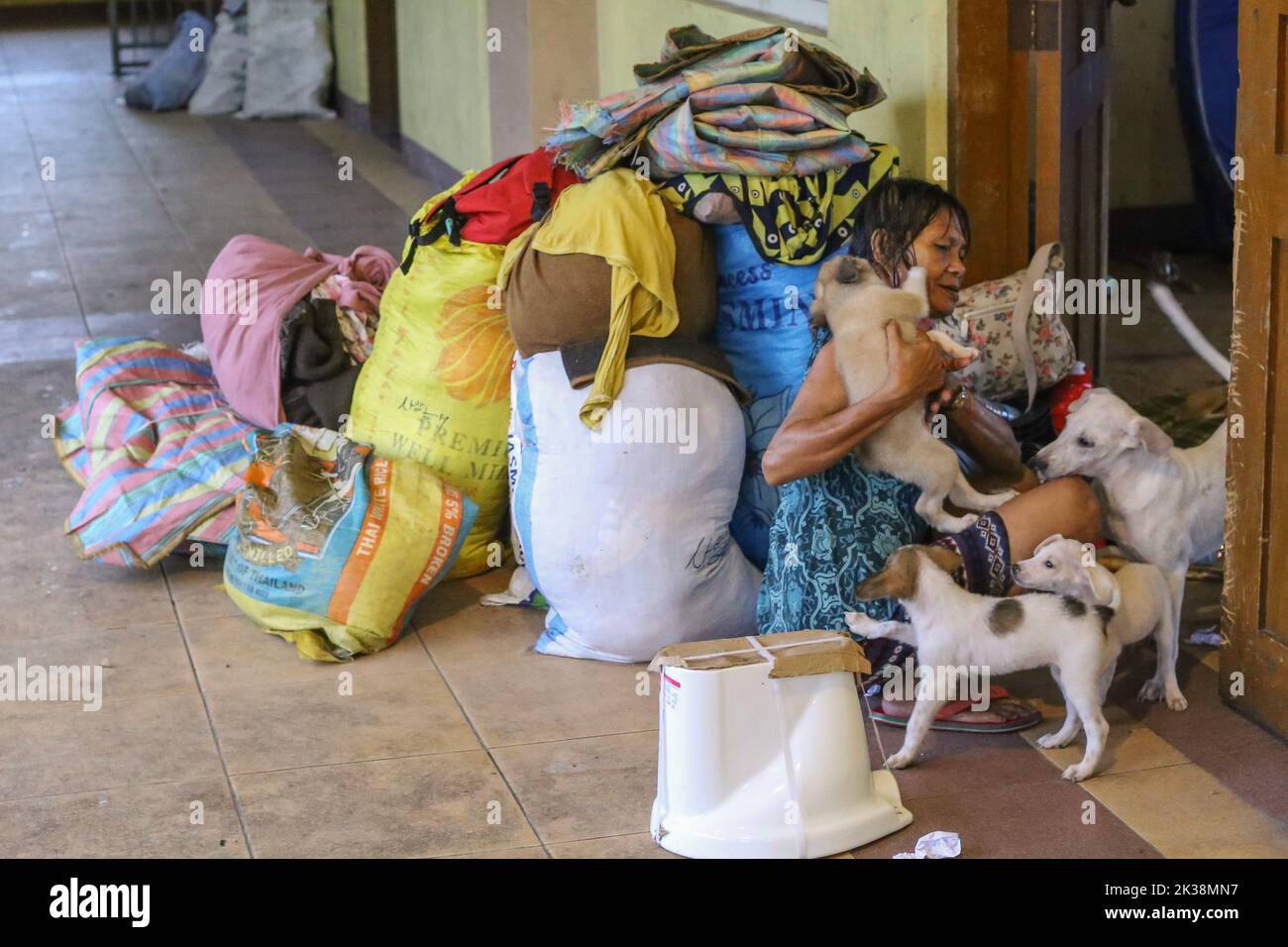 September 25, 2022, Baseco, Manila, Philippines: A woman along with her ...