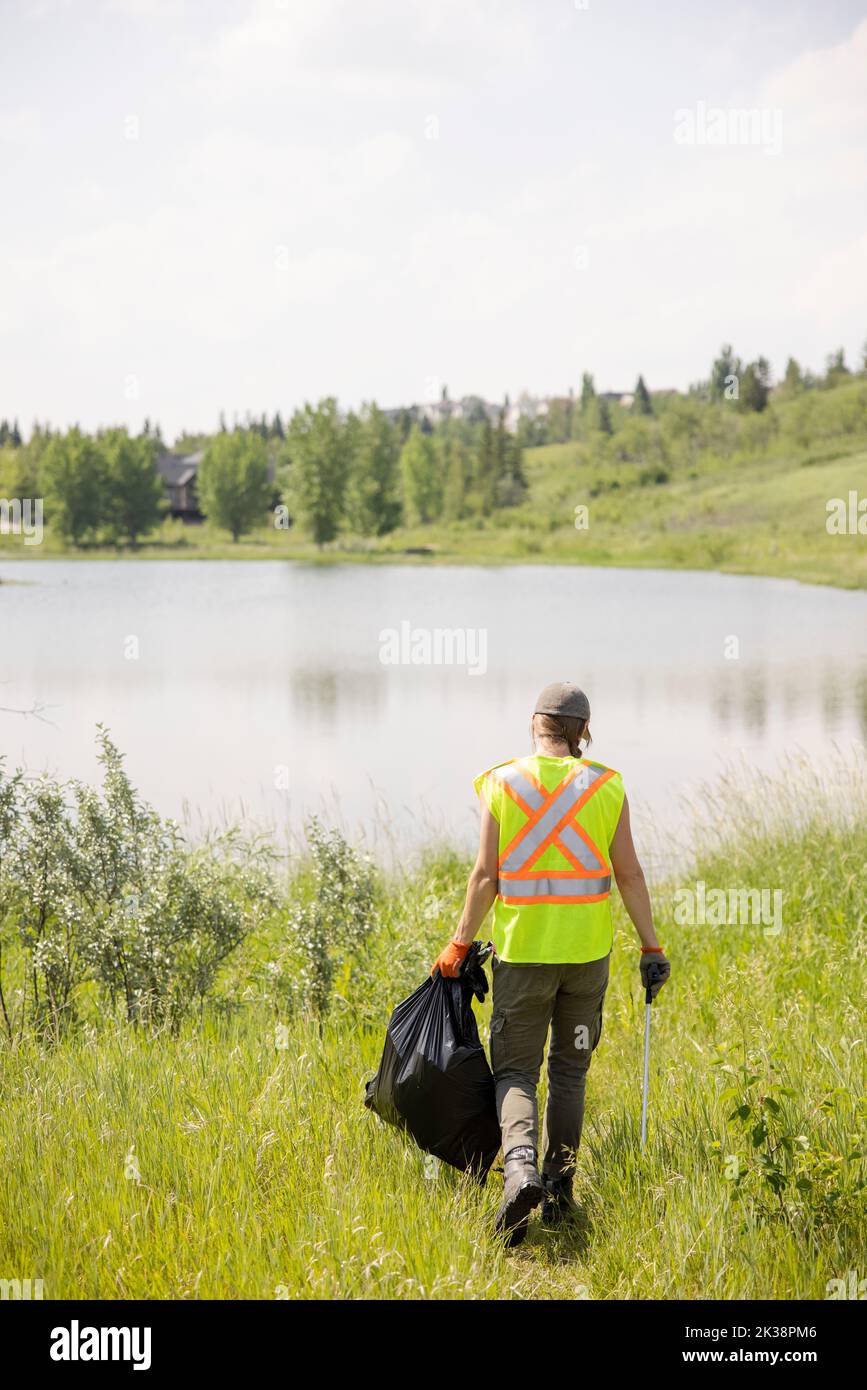 Carrying litter hi-res stock photography and images - Alamy