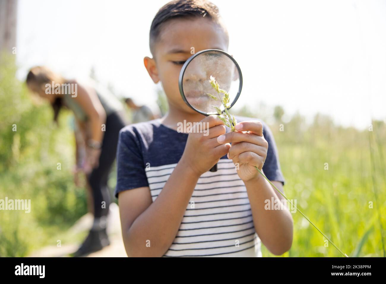 Boy looking through magnifying glass Stock Photo - Alamy Boy looking through magnifying glass Stock Photo - Alamy