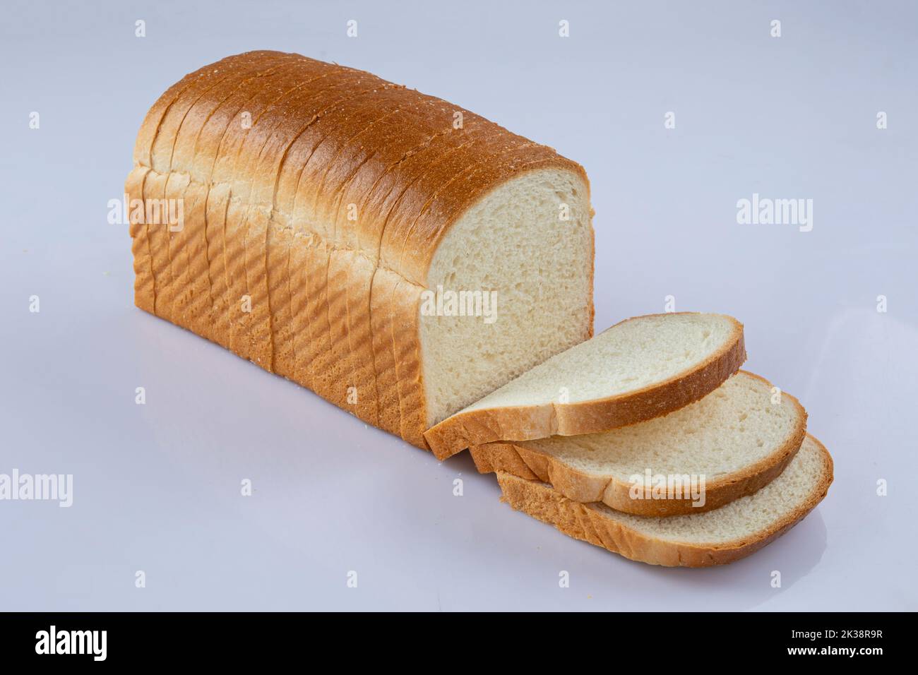 whole wheat bread slices on a white background Stock Photo - Alamy