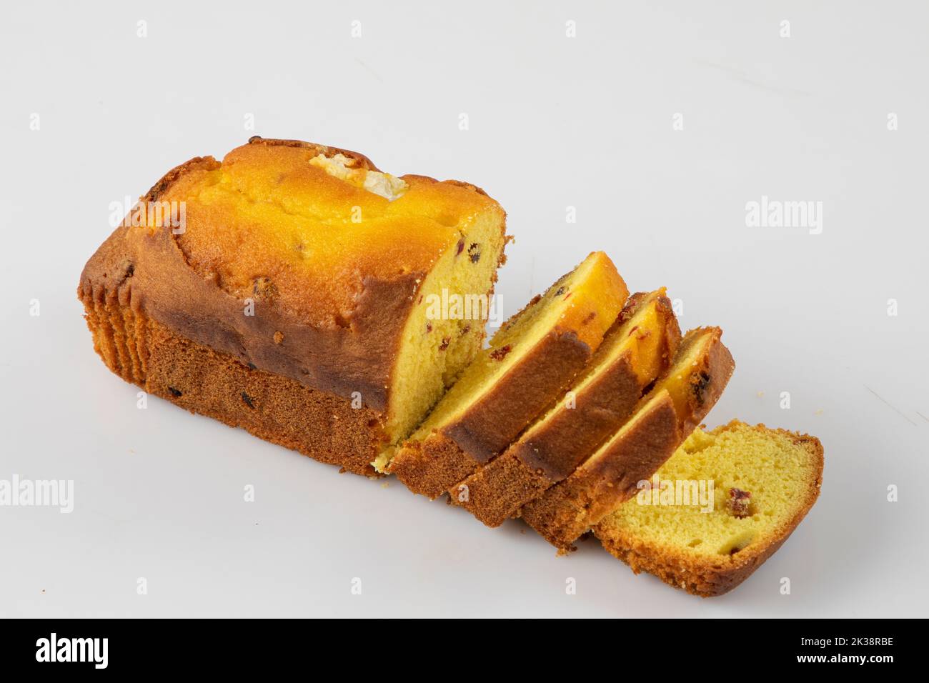 Sliced moist butter cake isolated over the white background. Pineapple ...