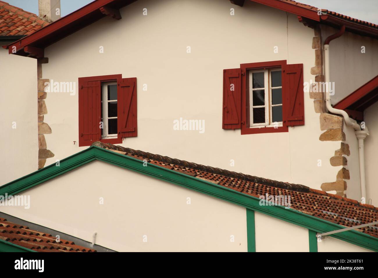 A beautiful view of a traditional house with small windows in Espelette ...