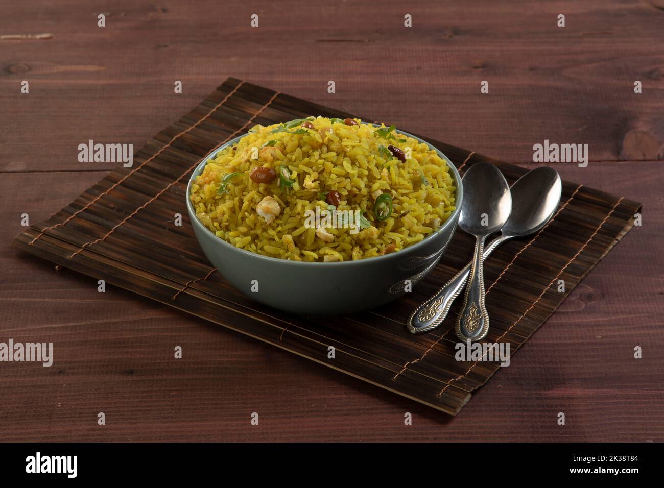 indian breakfast dish poha.Indian breakfast Poha topped with peanuts ...