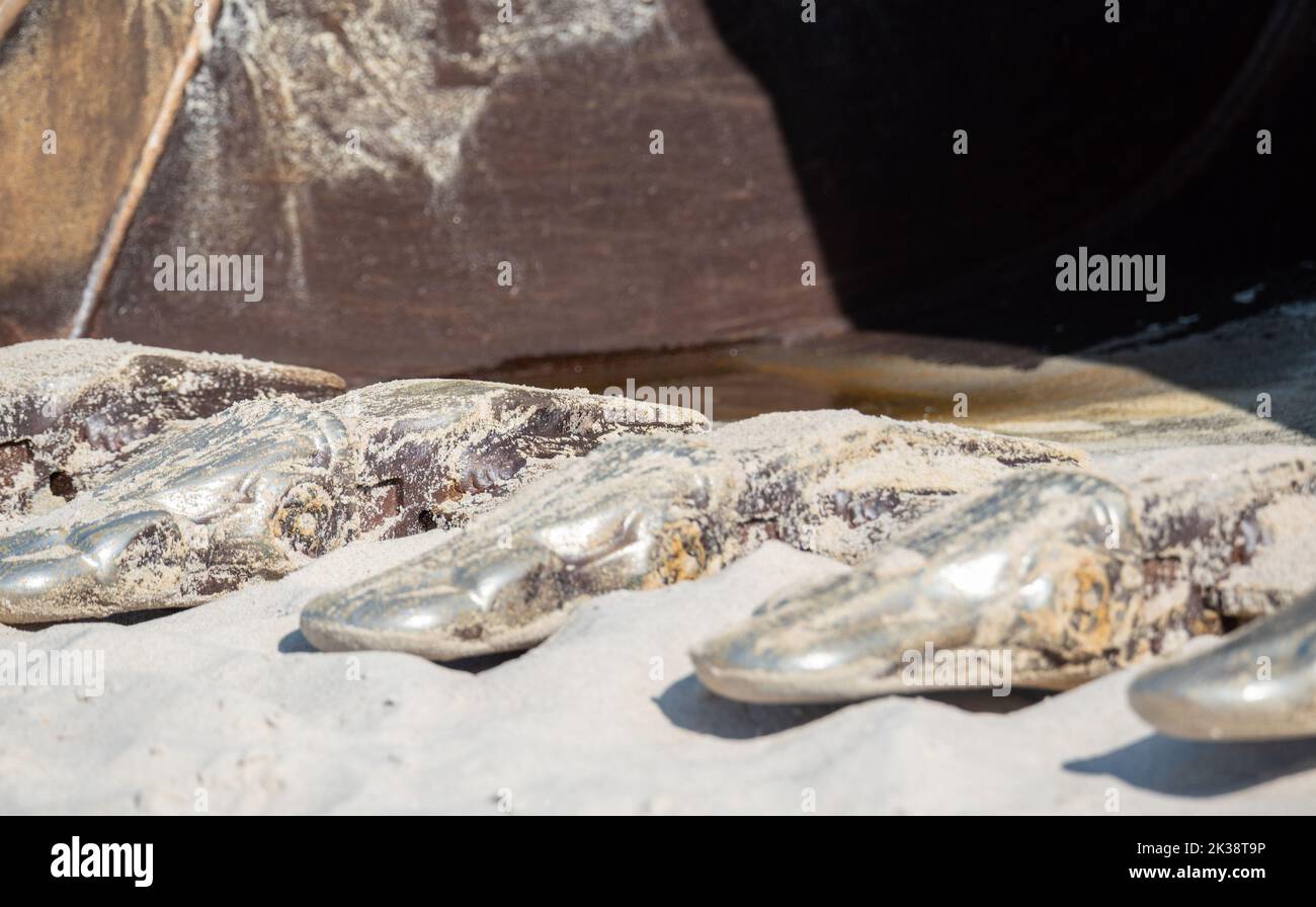 Excavator bucket on sand. Construction equipment on the beach. Heavy ...