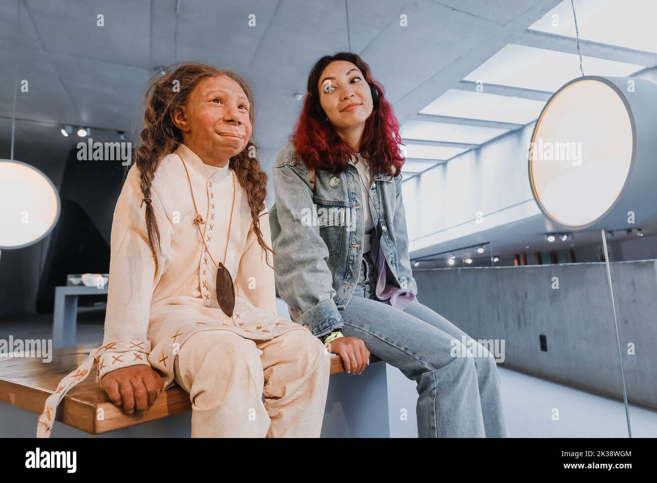 22 July 2022, Neanderthal museum, Germany: Woman visitor looking at Wax ...