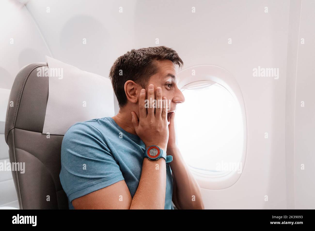 Scared passenger on plane hi-res stock photography and images - Alamy