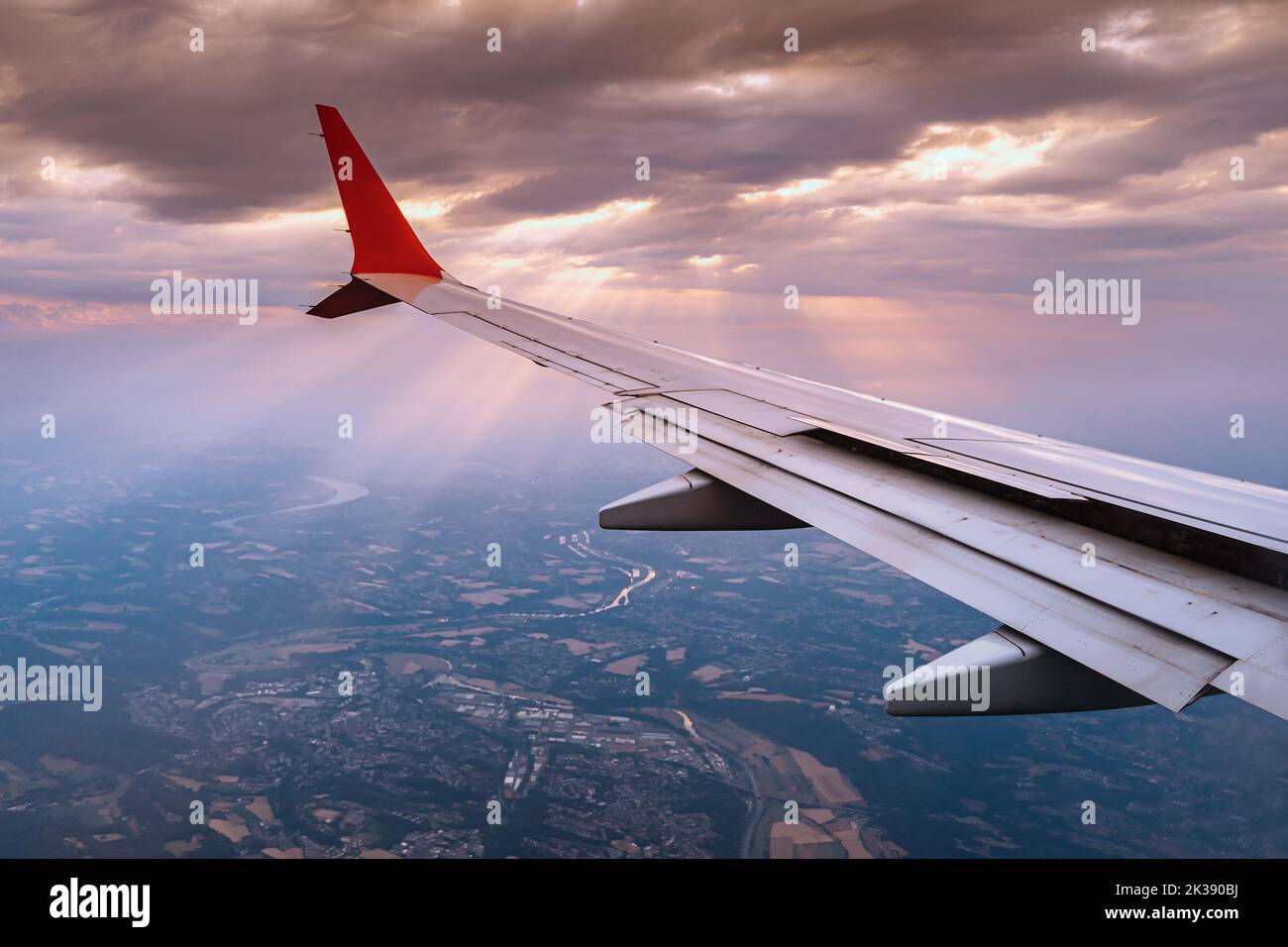 Airplane wing view from the window during a flight on vacation or on ...