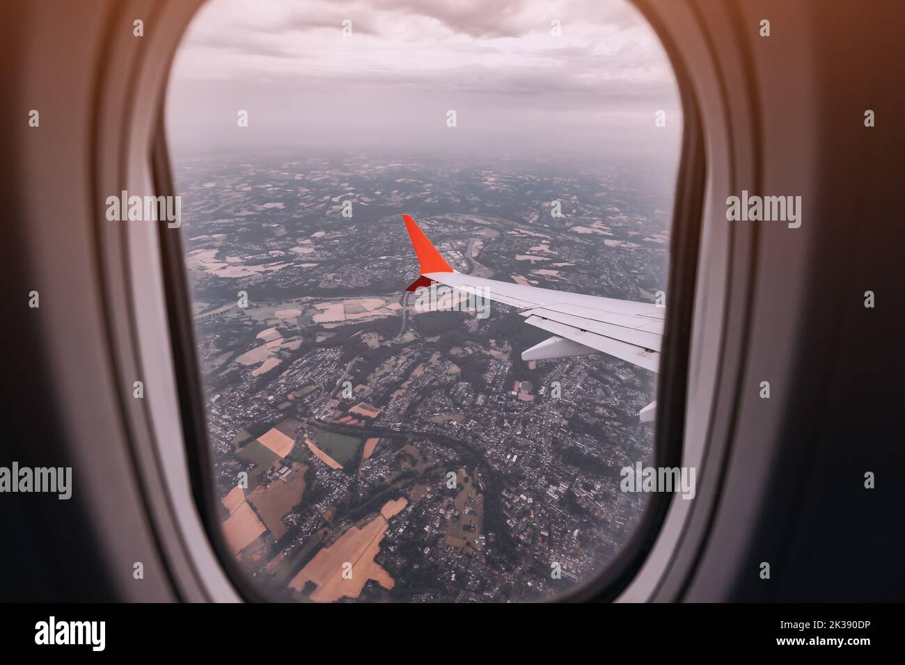 Airplane wing view from the window during a flight on vacation or on ...