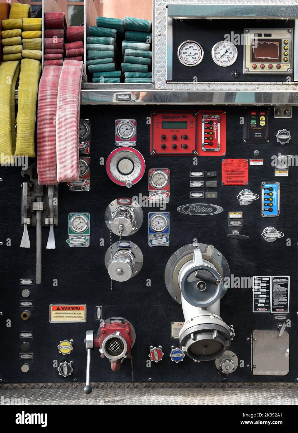 The control panel on the side of a U.S. fire truck with various valves ...