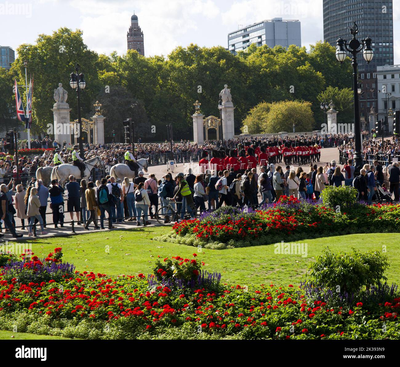 Crowds of Sightseers and Tourists Watching Marching Guards Band Queen Victoria Monument and ...