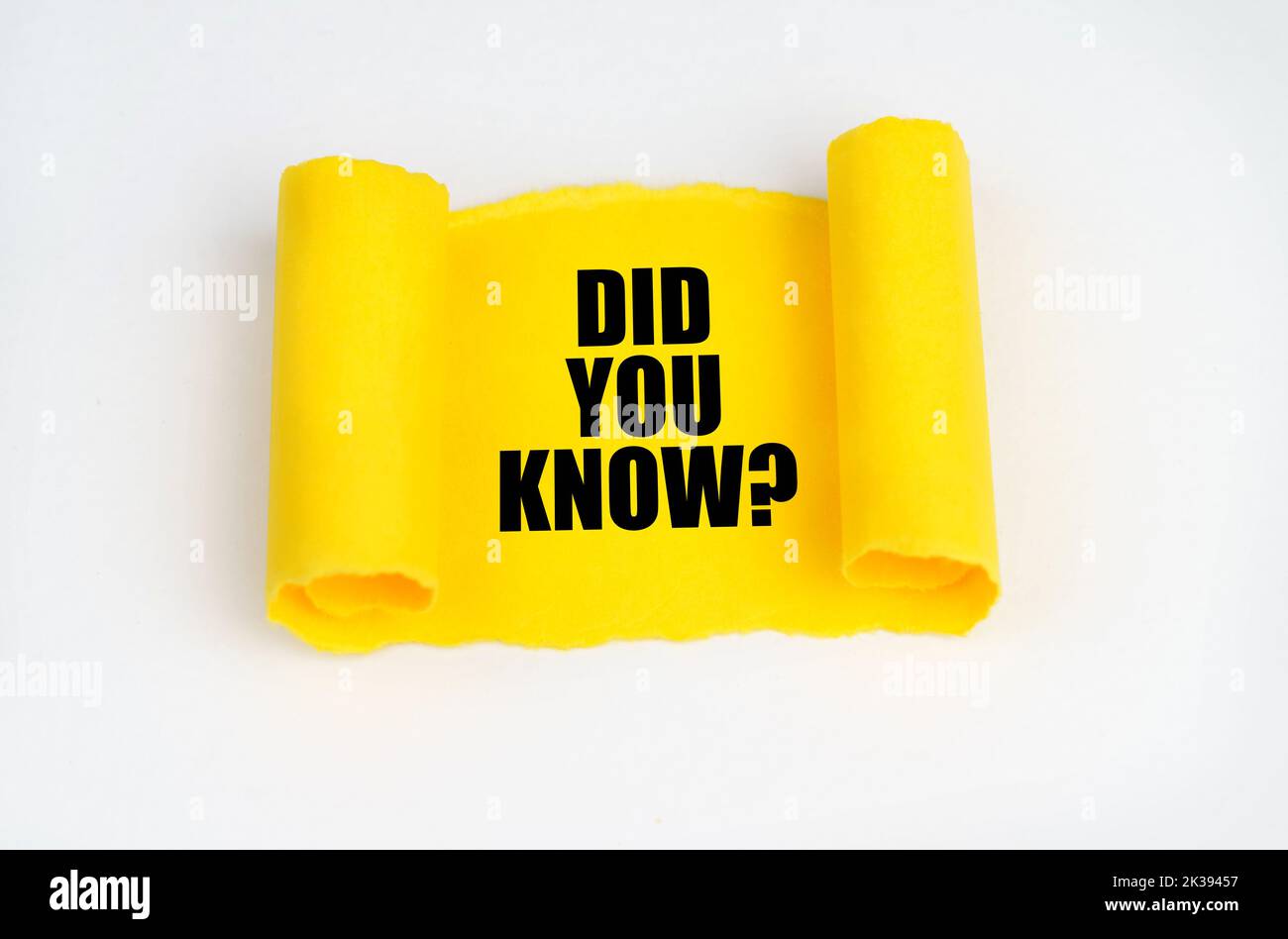 On a white surface, a yellow scroll of paper with the inscription - DID ...