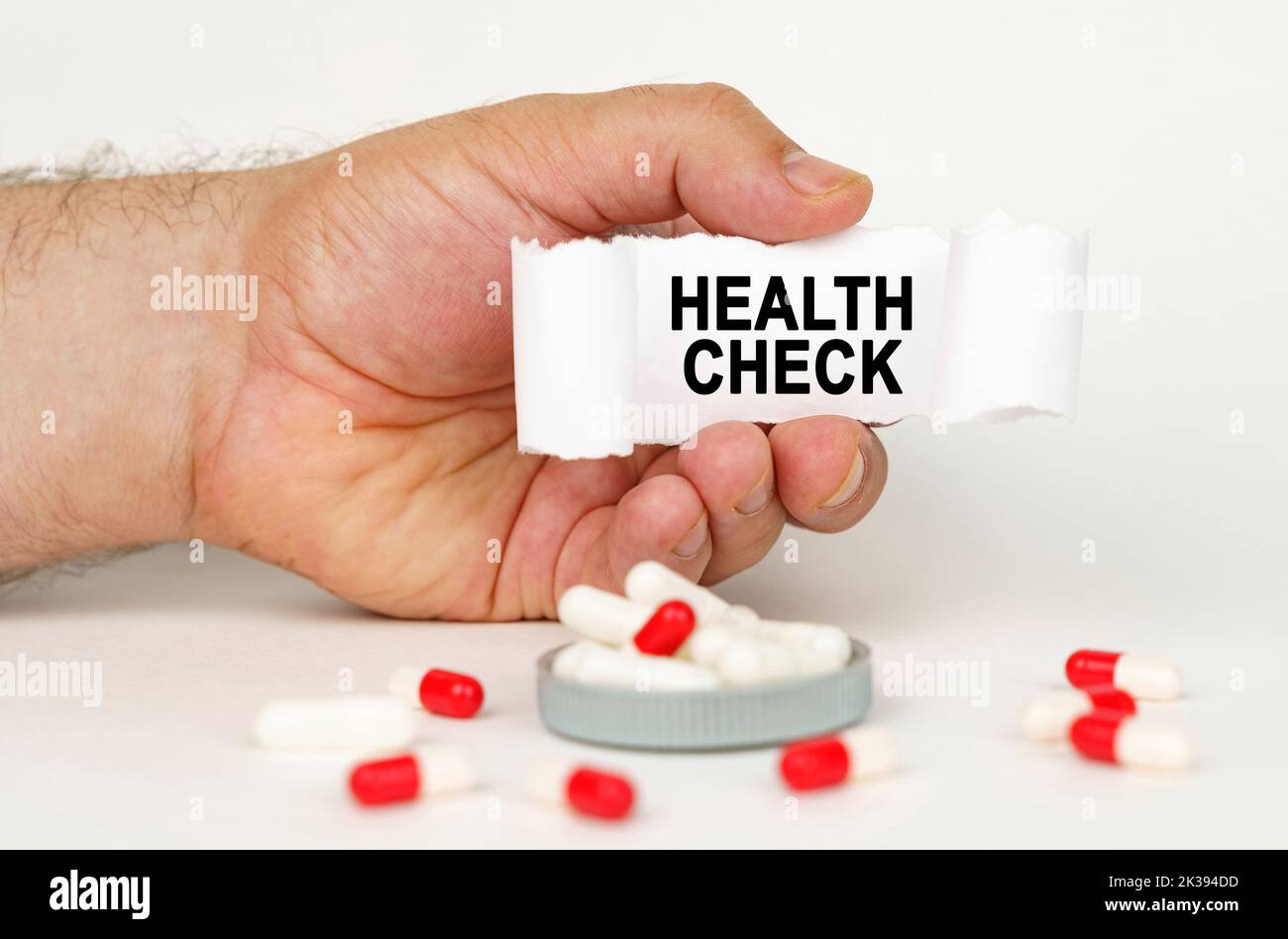Medical concept. On a white background, medical capsules, in the hands ...