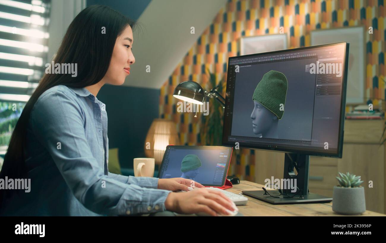 Female asian 3D designer having remote work on 3D modeling and creating ... Female asian 3D designer having remote work on 3D modeling and creating ...