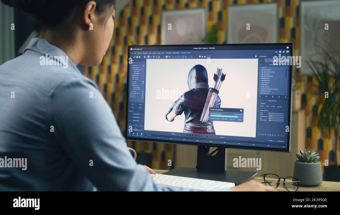 Female 3D designer creating and drawing character for video game using ...