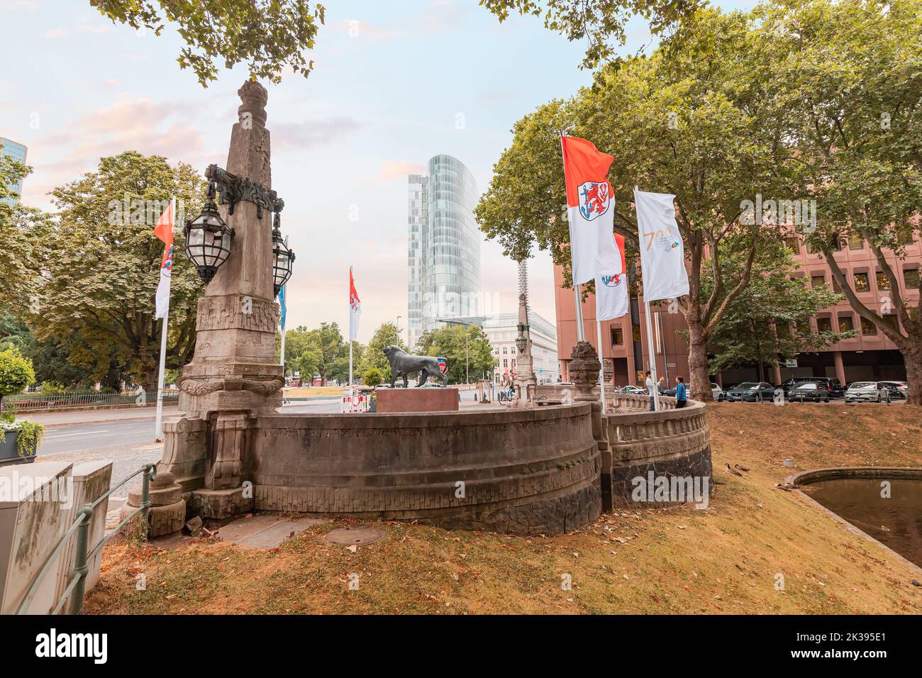 21 July 2022, Dusseldorf, Germany: statue and flags with lion - the ...