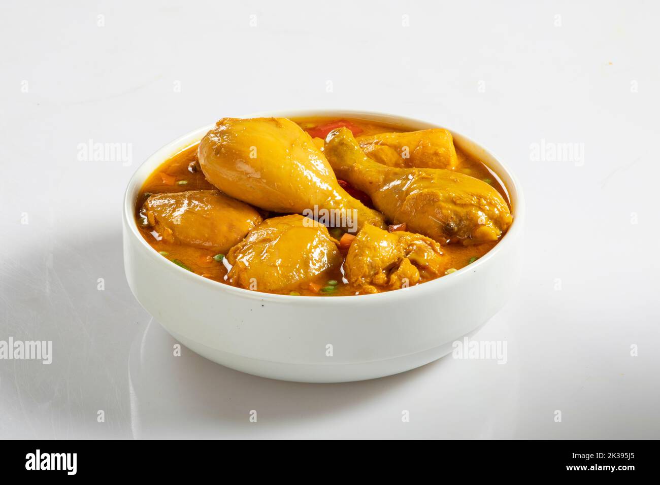 Chicken curry in white bowl on white background Stock Photo - Alamy