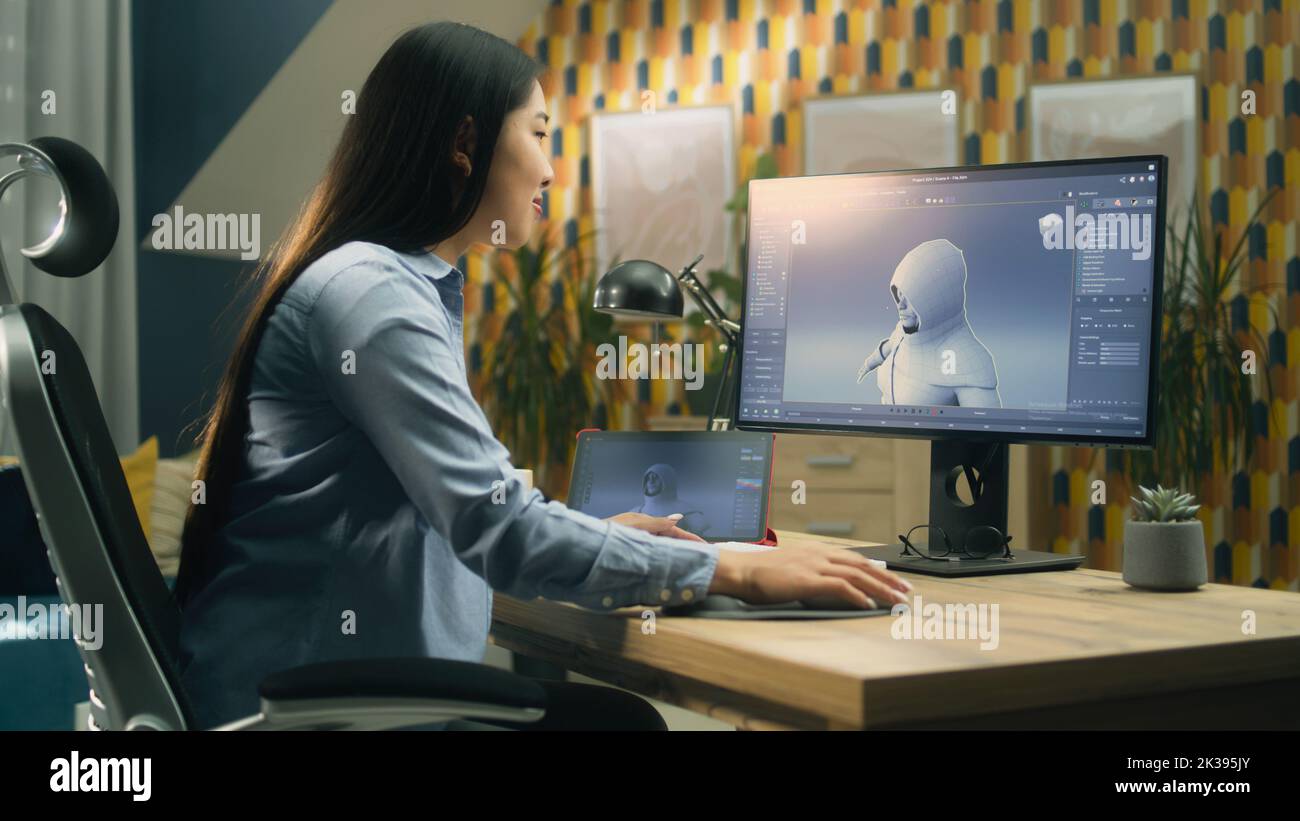Asian female 3D designer creating and drawing character for video game ...
