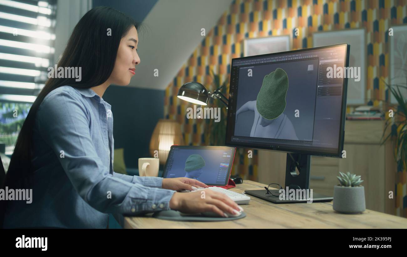 Female asian 3D designer having remote work on 3D modeling and creating ... Female asian 3D designer having remote work on 3D modeling and creating ...