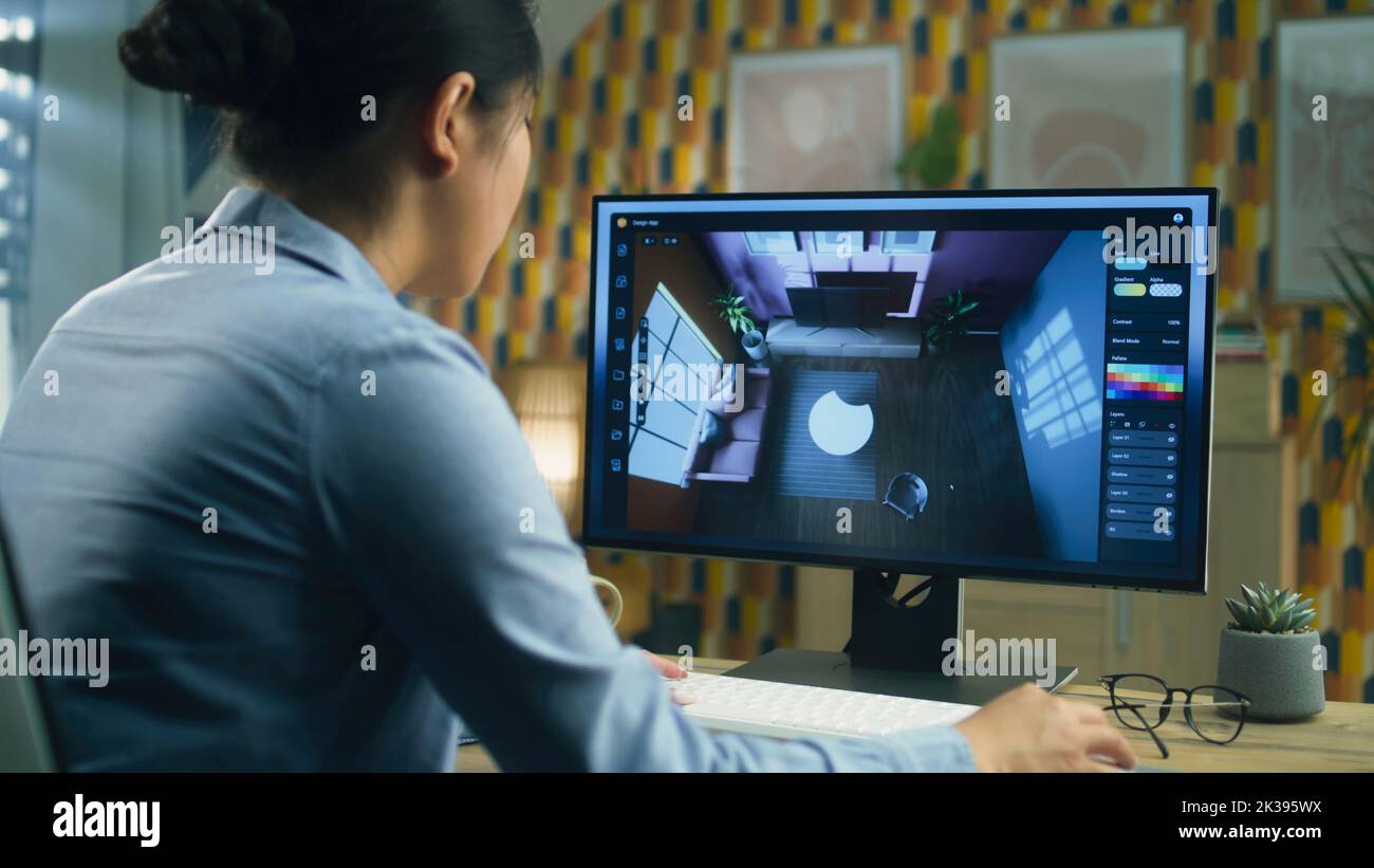 Woman designing house interior in modern computer program for 3D ...