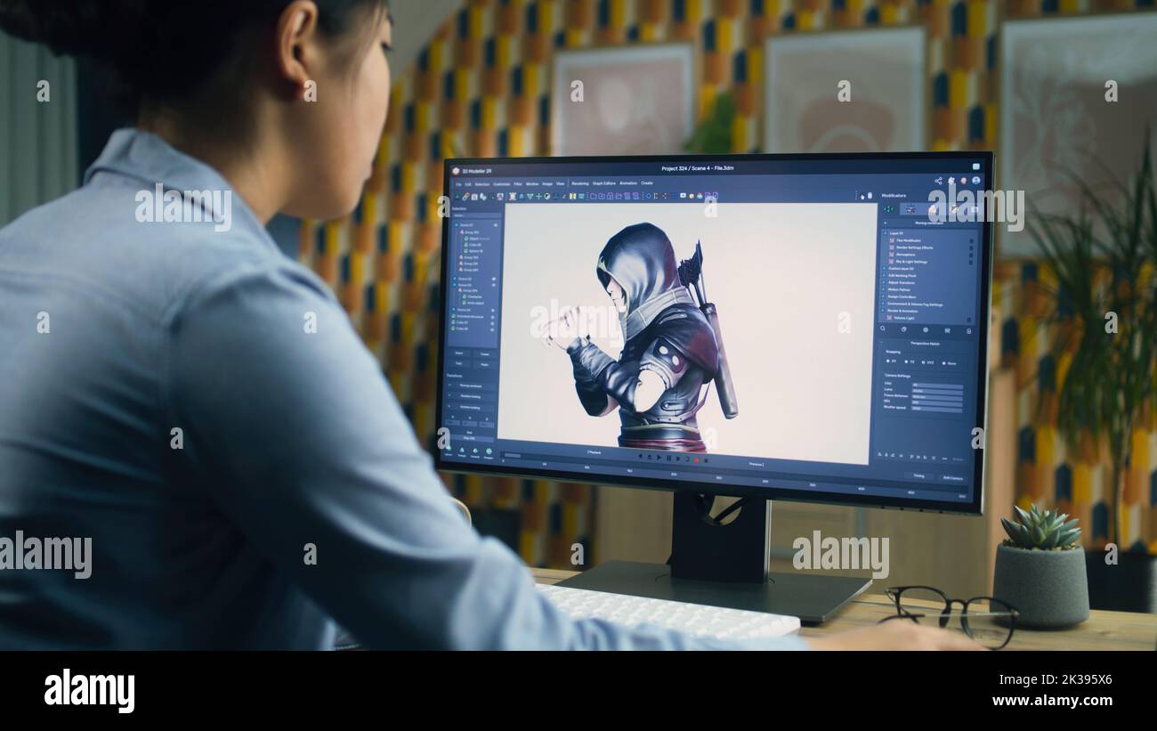 Female 3D designer creating and drawing character for video game using ...