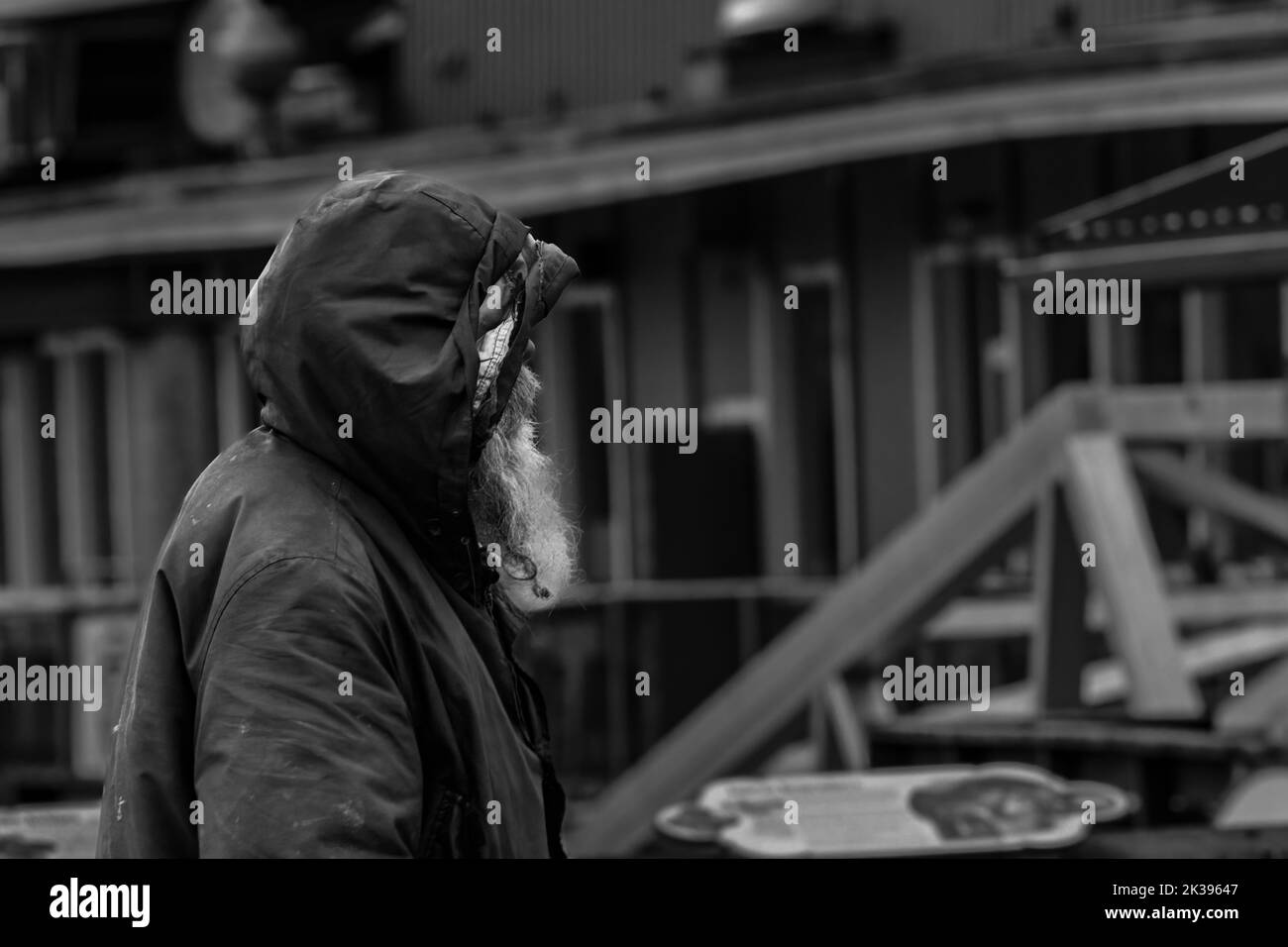 A greyscale shot of a homeless male in the city of Juneau Stock Photo ...