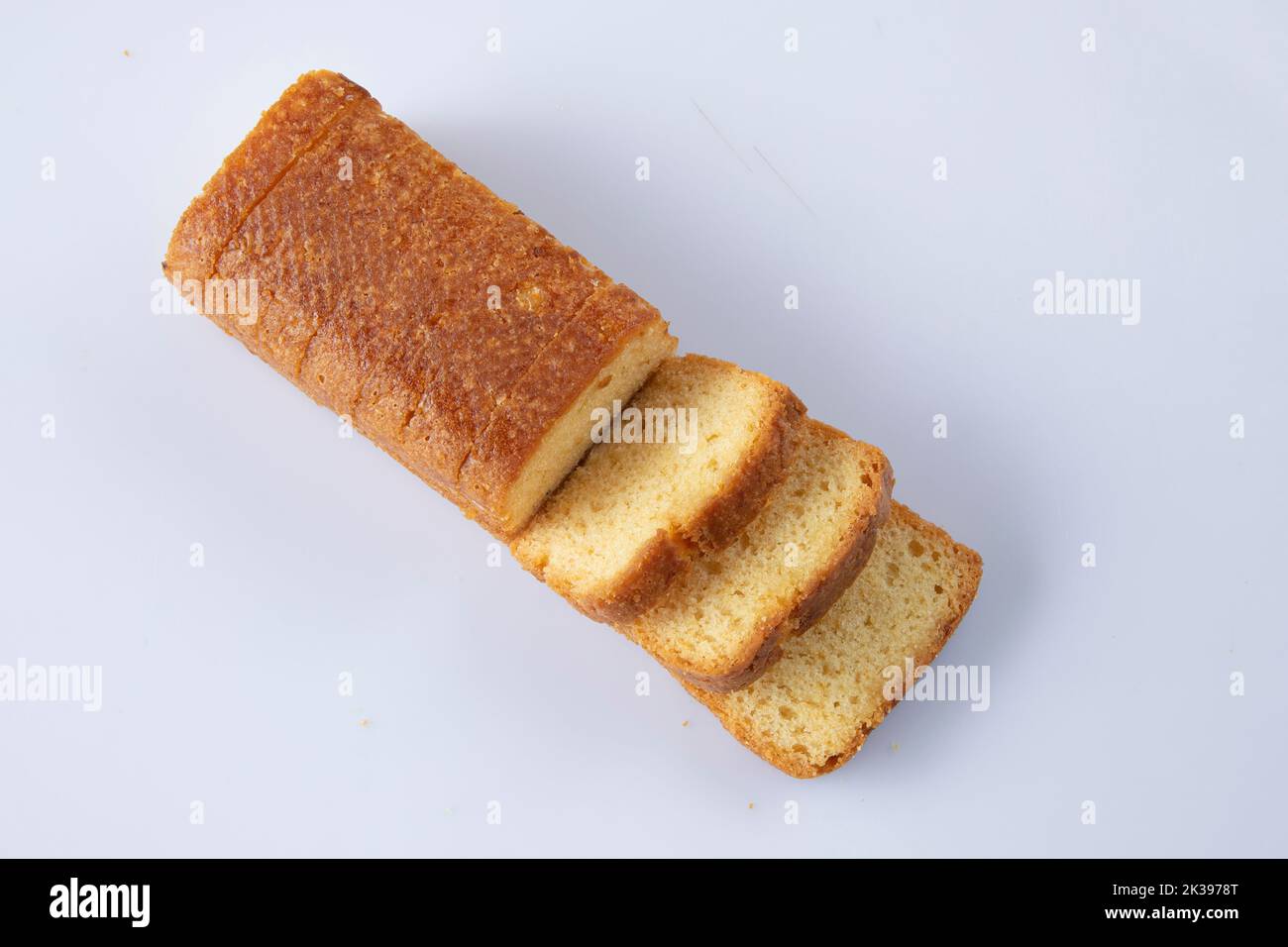 Sliced moist butter cake isolated over the white background. Pineapple ...