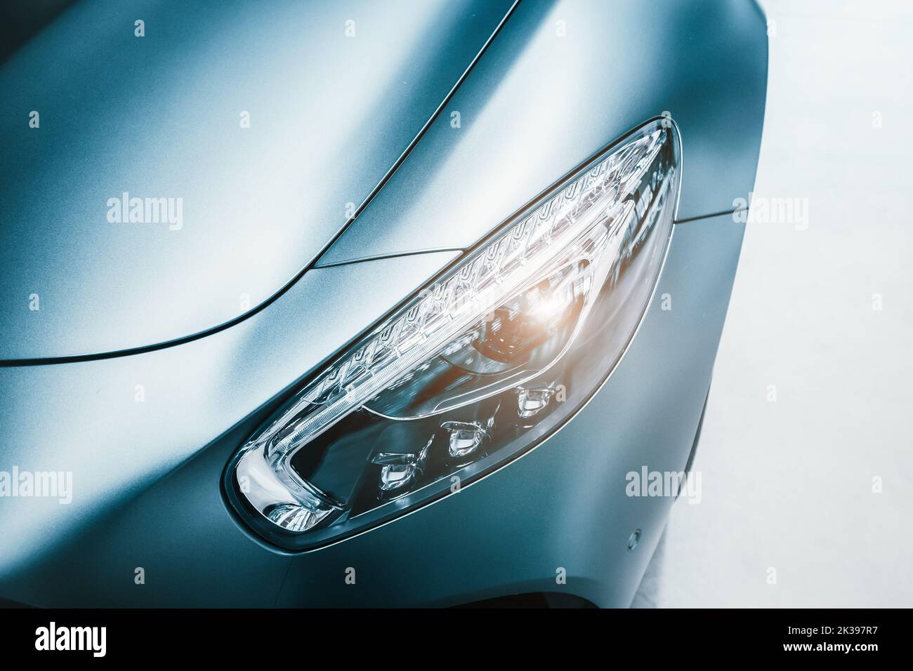 Close-up detailed view of the headlights of a luxury car in the garage ...
