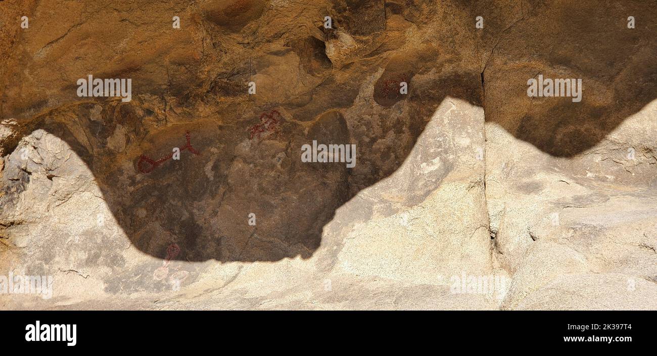 A natural stone wall with different signs and symbols at the Joshua ...