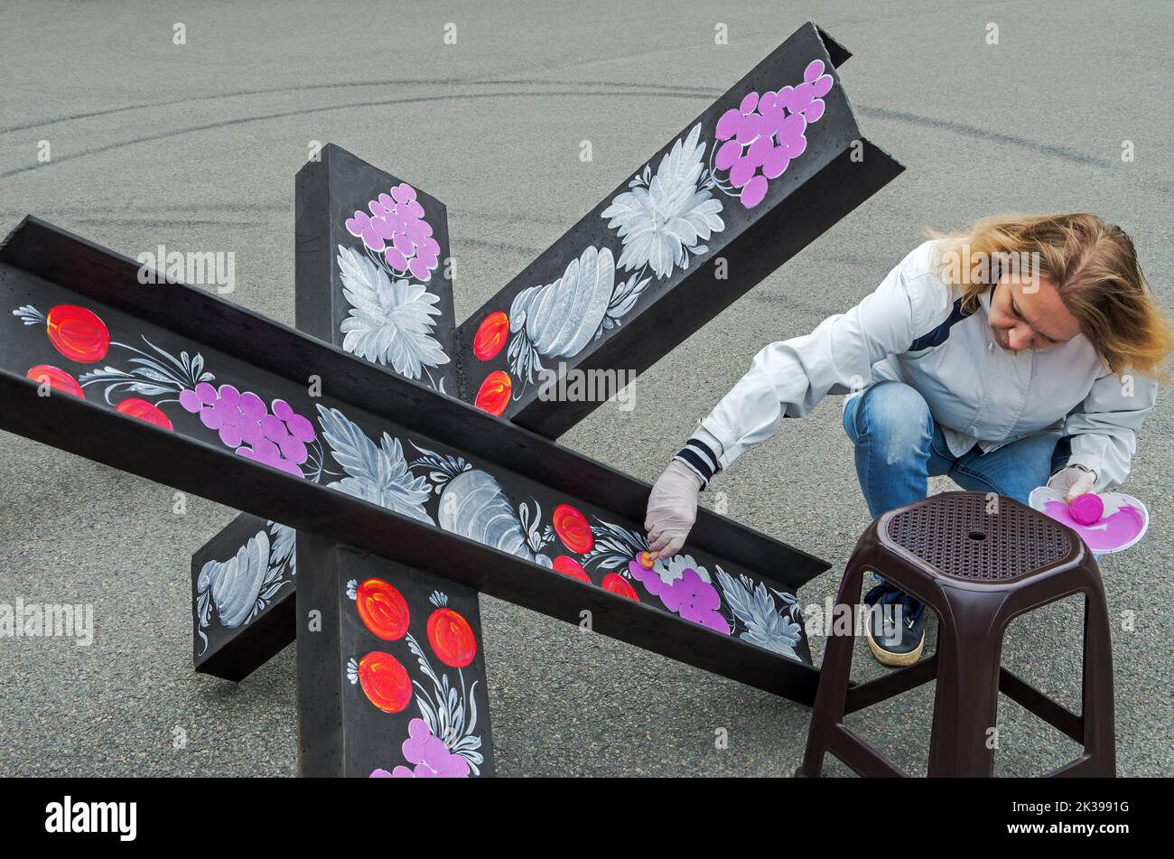 Dnipro, Ukraine - September 10, 2022: Woman artist paint metal anti ...