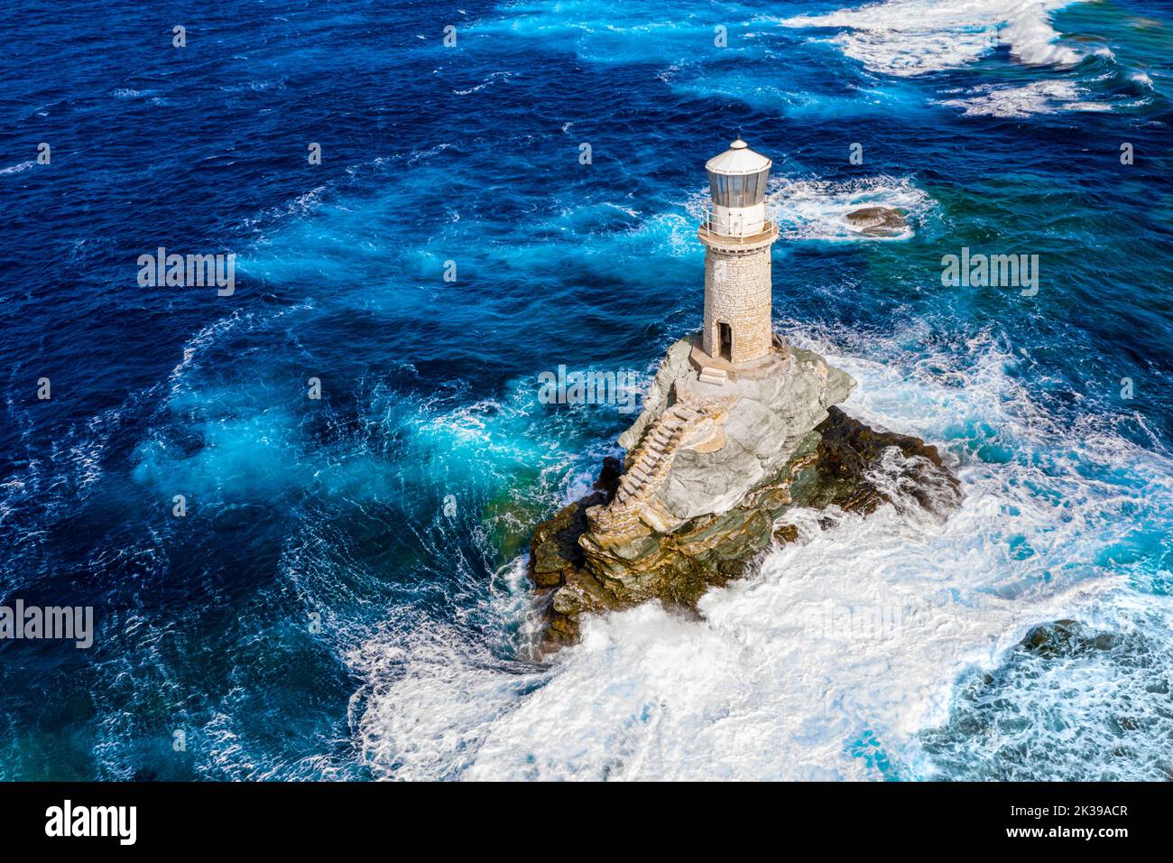 View of the Lighthouse Tourlitis during strong waves. Andros island ...