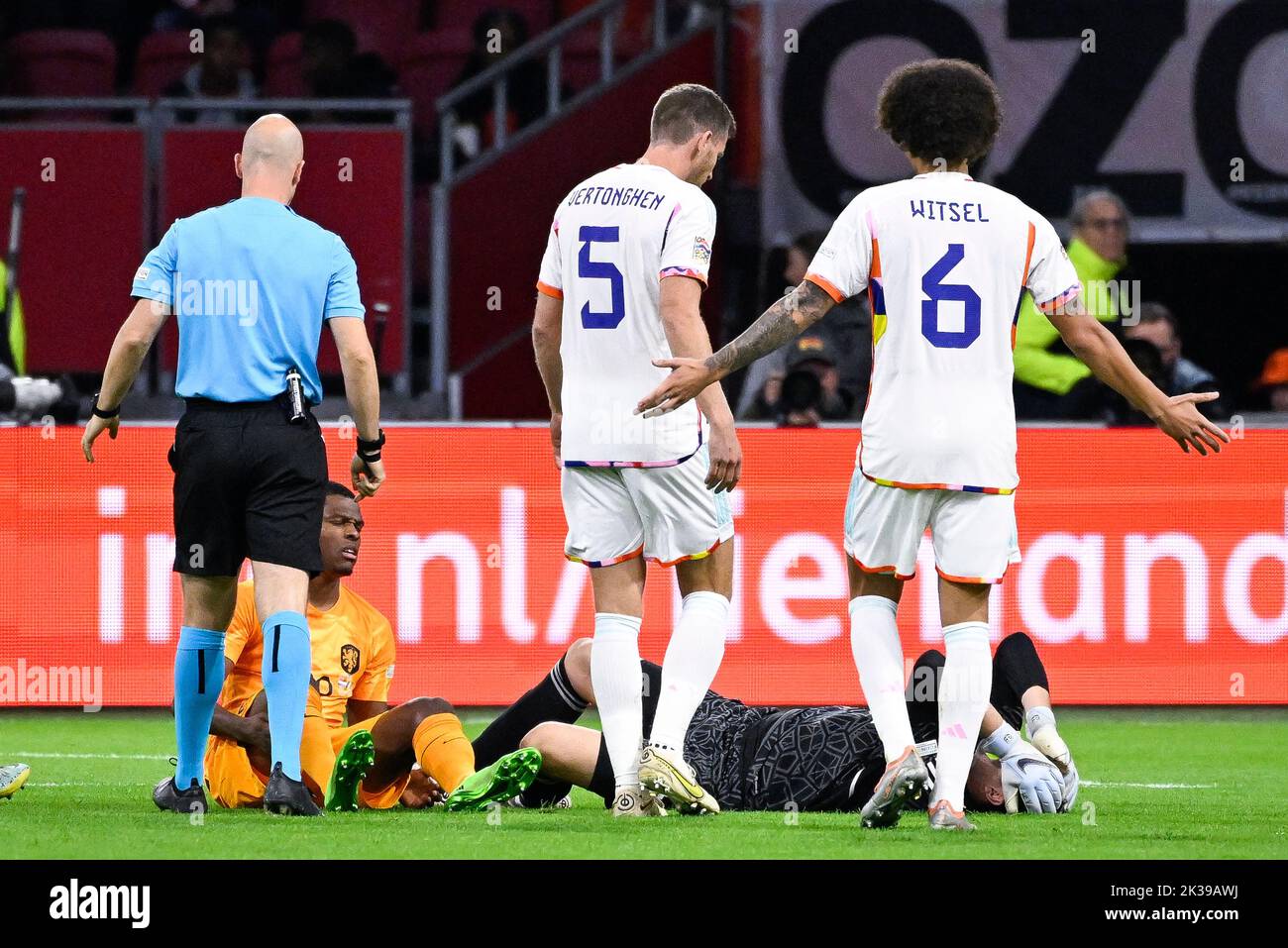 Belgium's goalkeeper Thibaut Courtois lies injured on the ground during ...