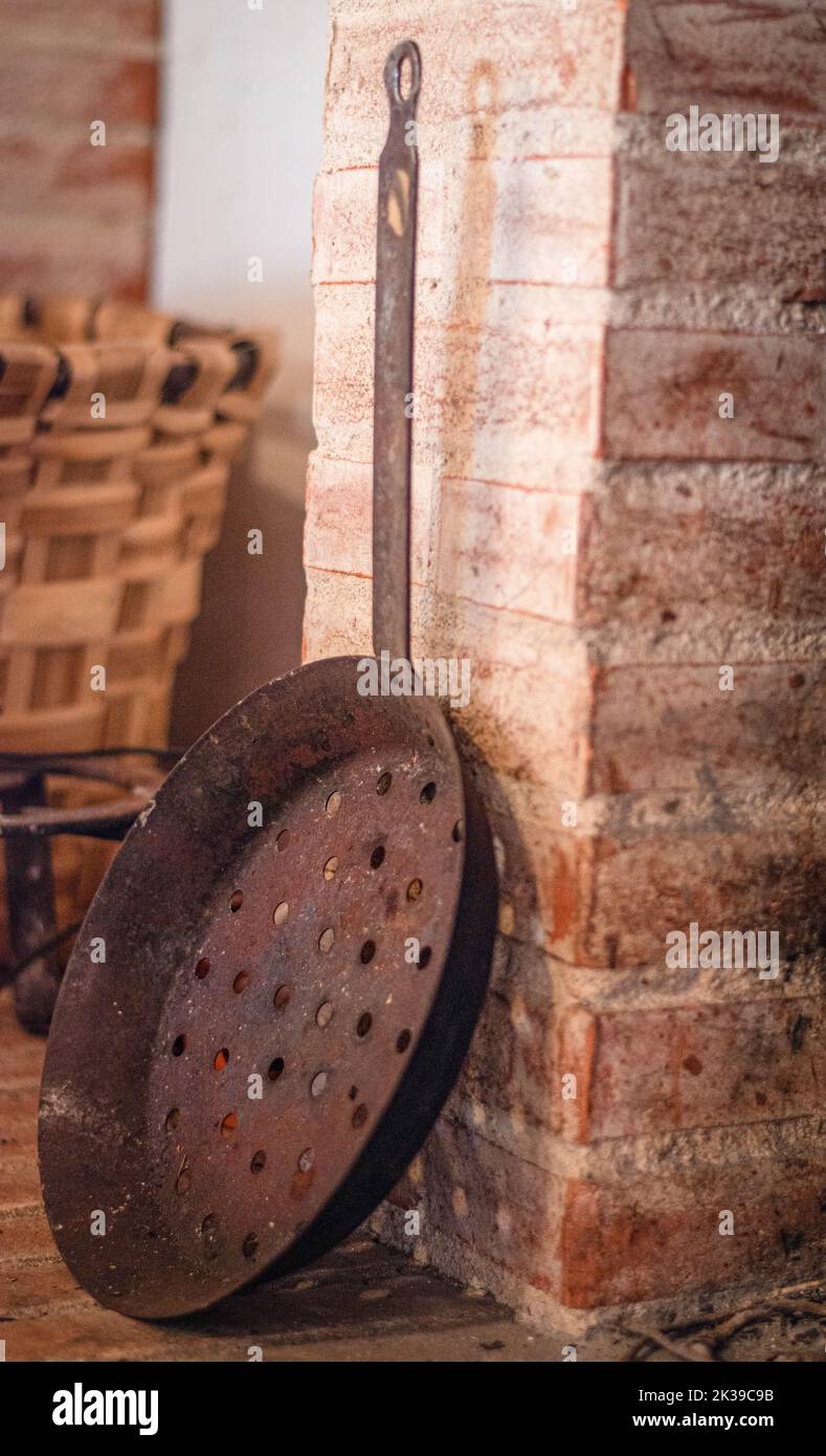 Pan for roasting chestnuts in the fireplace. Still life Stock Photo - Alamy