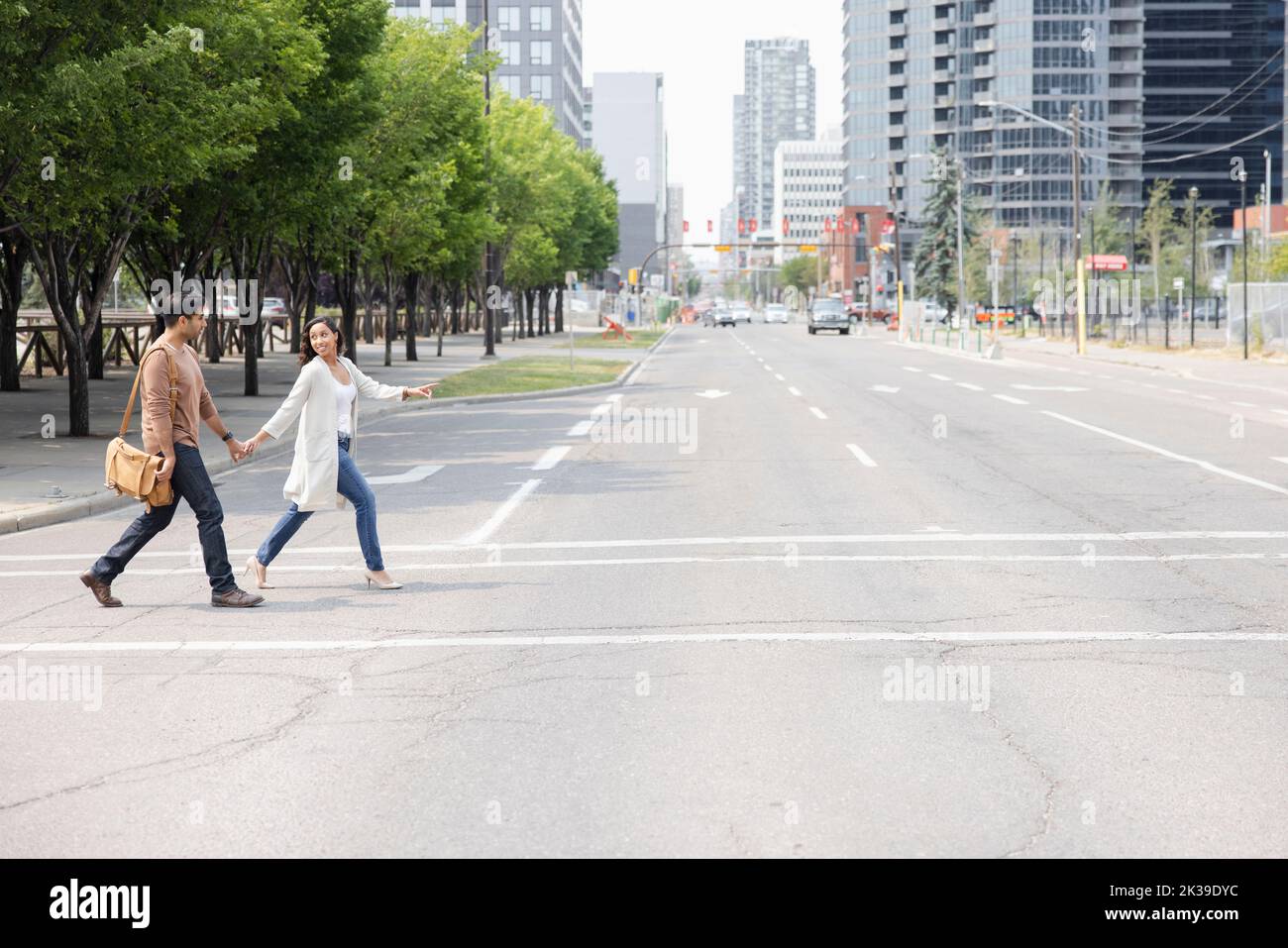 Couple Walking Hand In Hand On Road