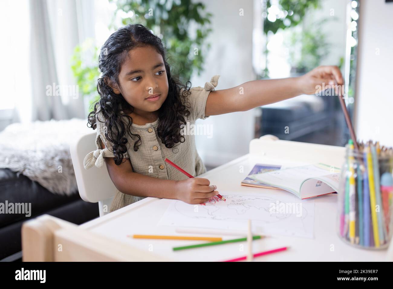 Girl pencils hi-res stock photography and images - Alamy