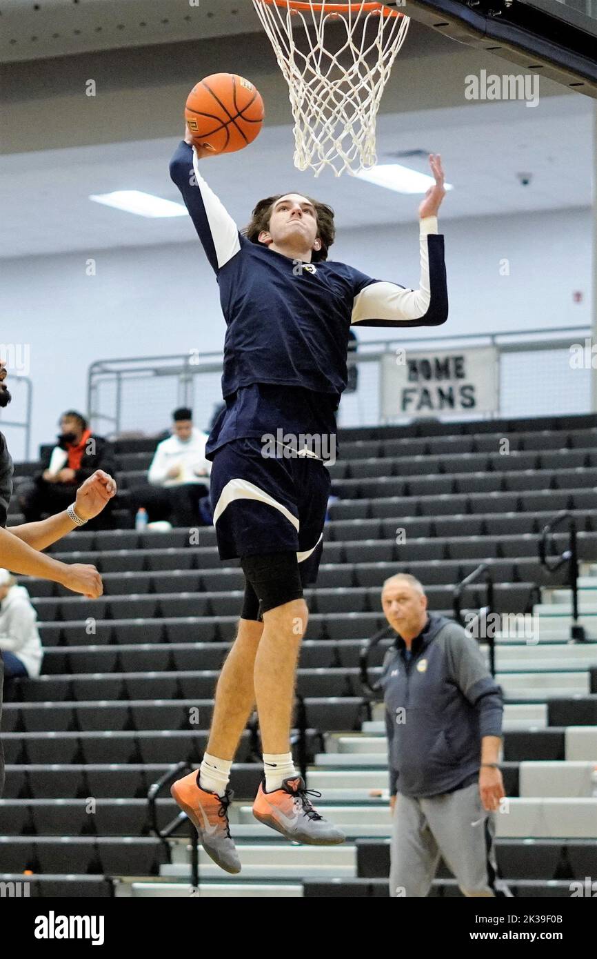 A young player actively playing basketball Stock Photo - Alamy