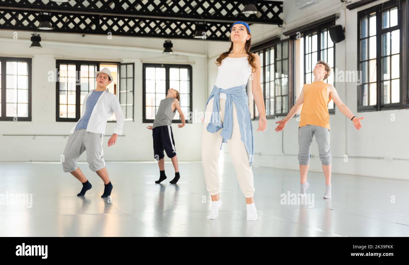 Team of young dancers training moves Stock Photo - Alamy
