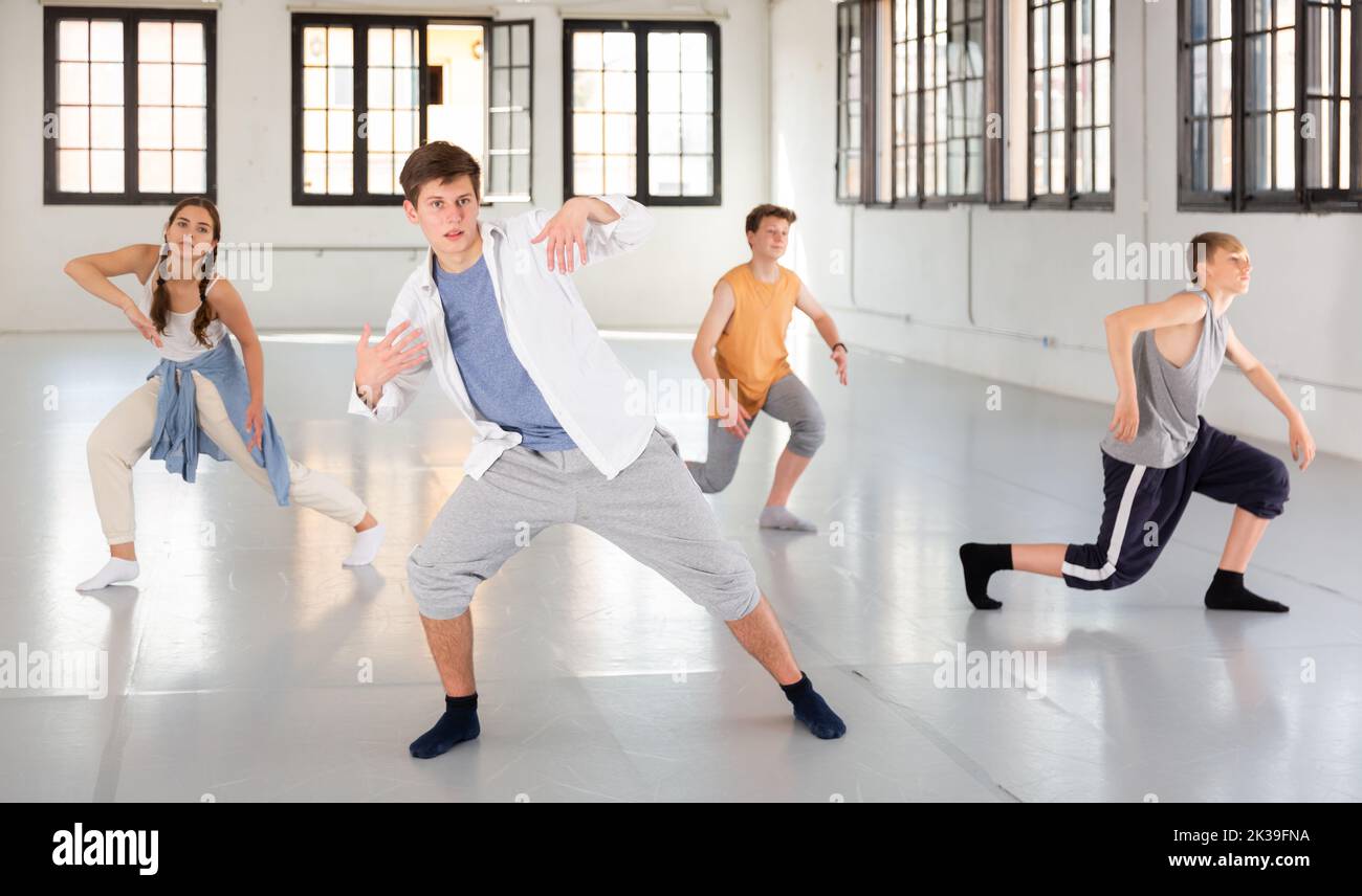 Team of young dancers training moves Stock Photo - Alamy