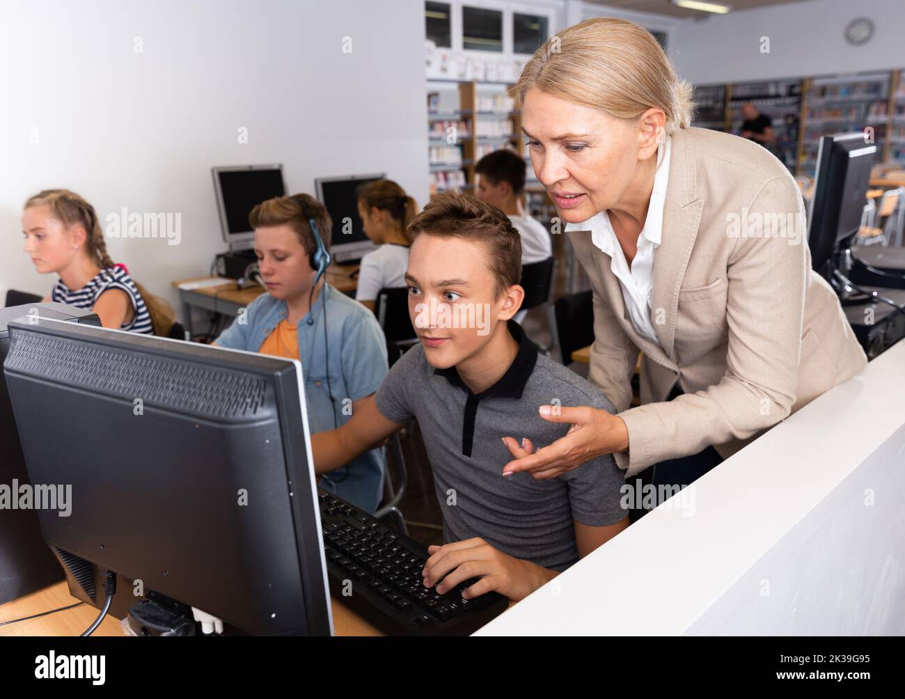 Students working with computers in classroom Stock Photo - Alamy