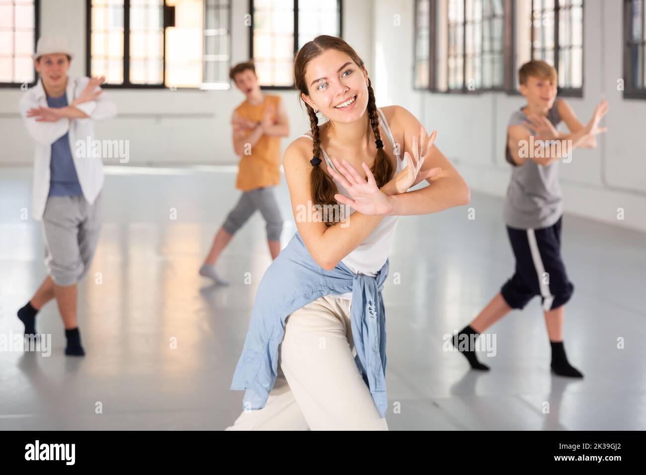 Teenage girl practicing active dance at studio Stock Photo - Alamy