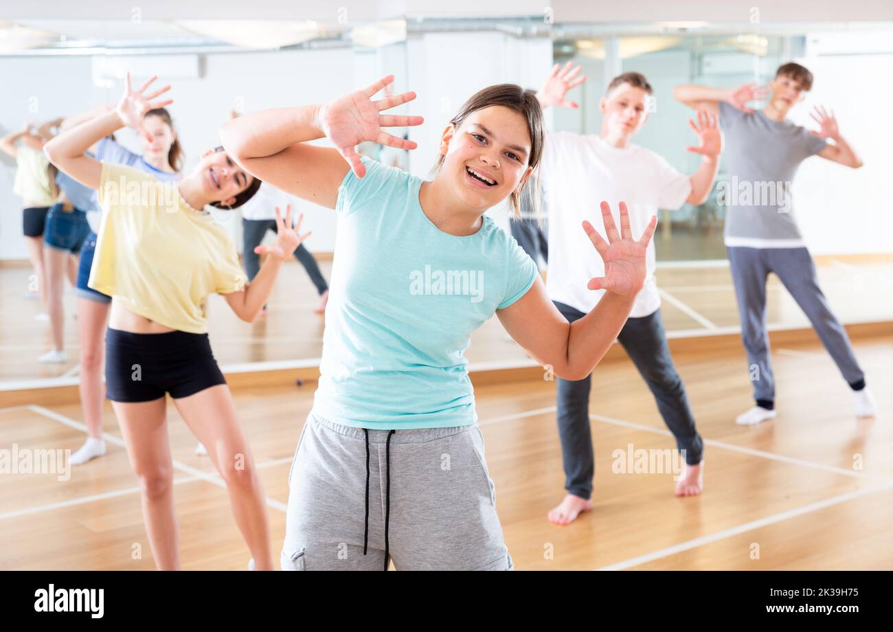 Teenage girl exercising during group dance class Stock Photo - Alamy