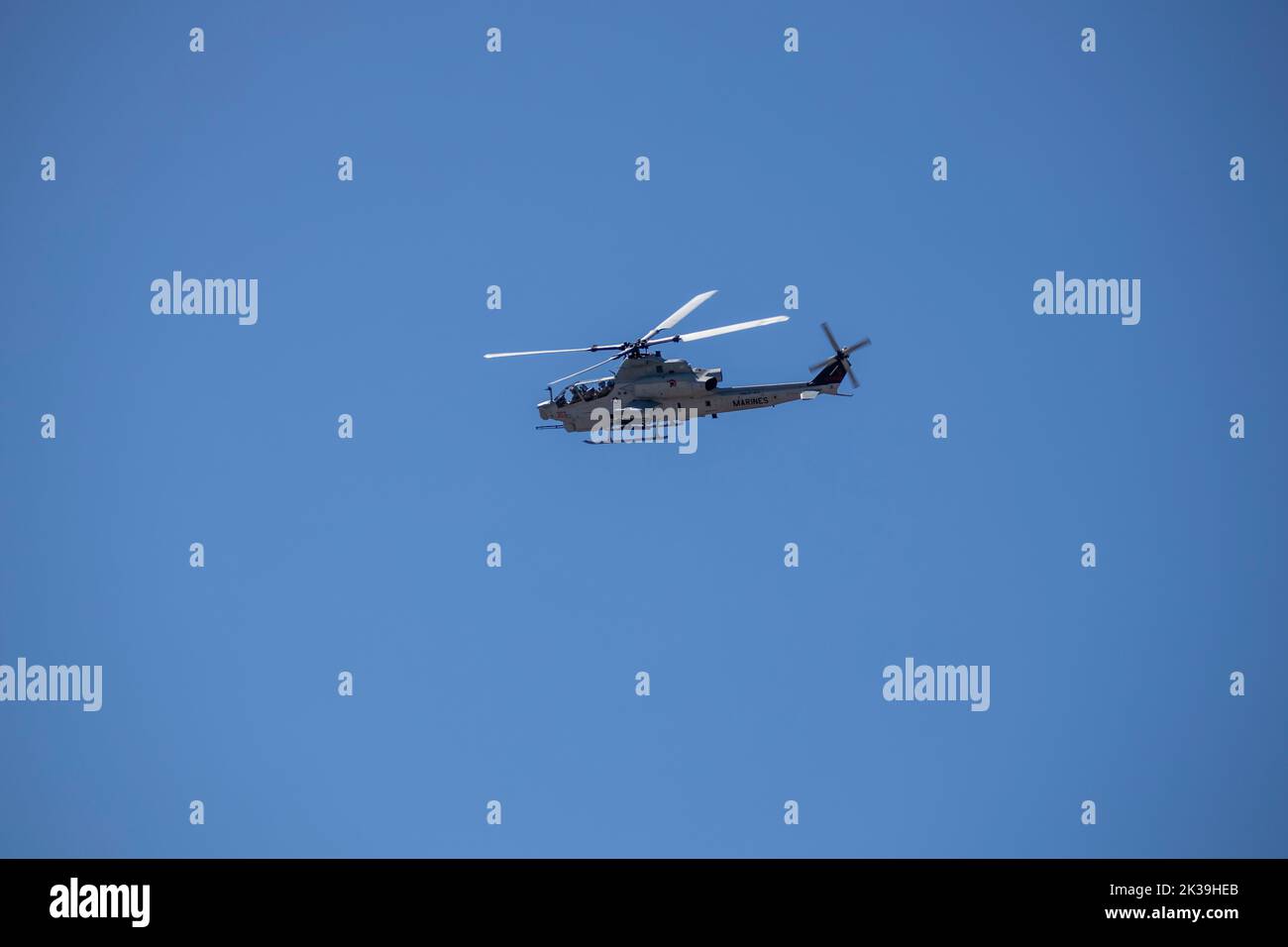 An AH-1Z Cobra flies above the flight line during the Marine Air-Ground ...